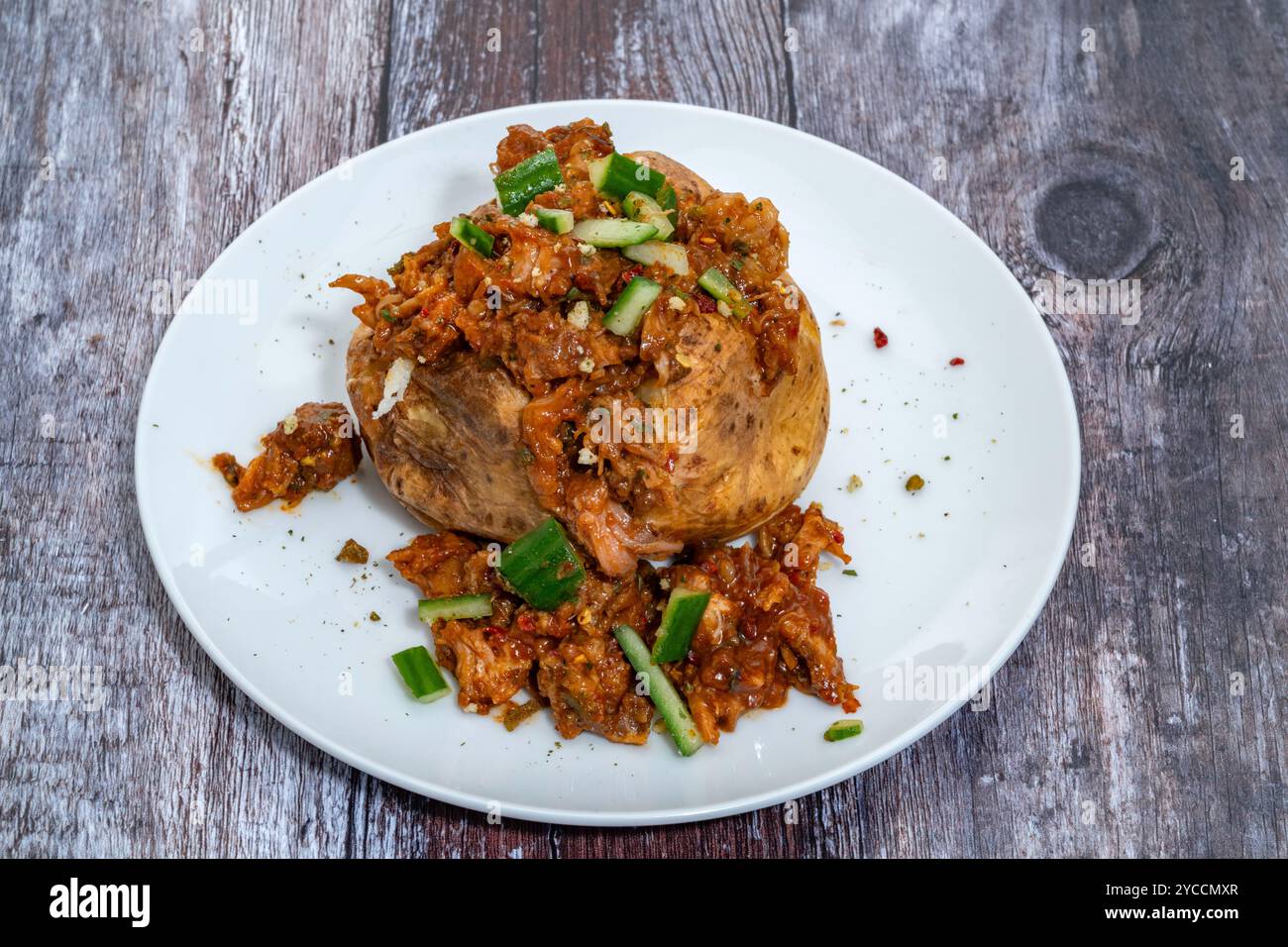 A jacket potato filled with pulled pork Stock Photo - Alamy