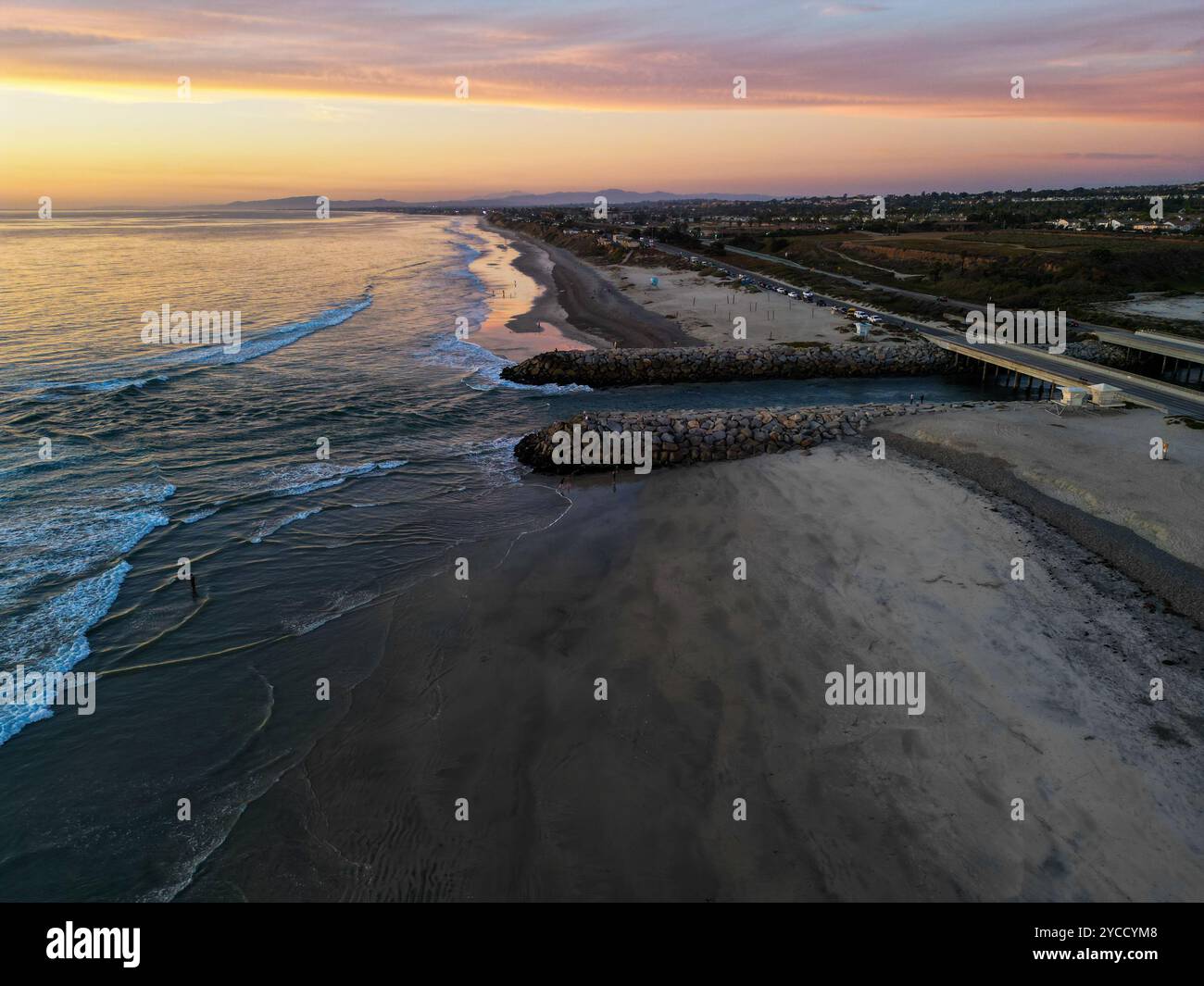 A Drone View of a Carlsbad, California, Sunset with dramatic colors in ...