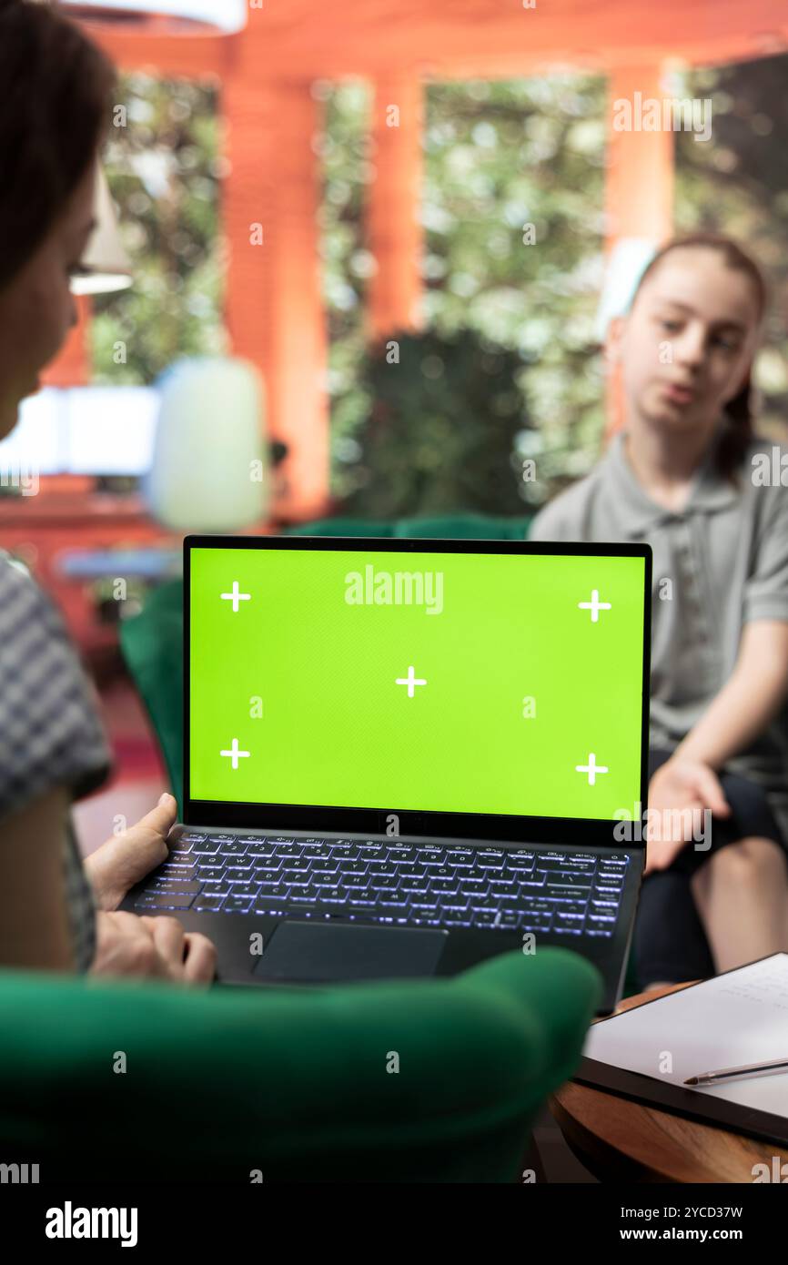 Teen girl in behavioral therapy next to copy space mockup discussing ...