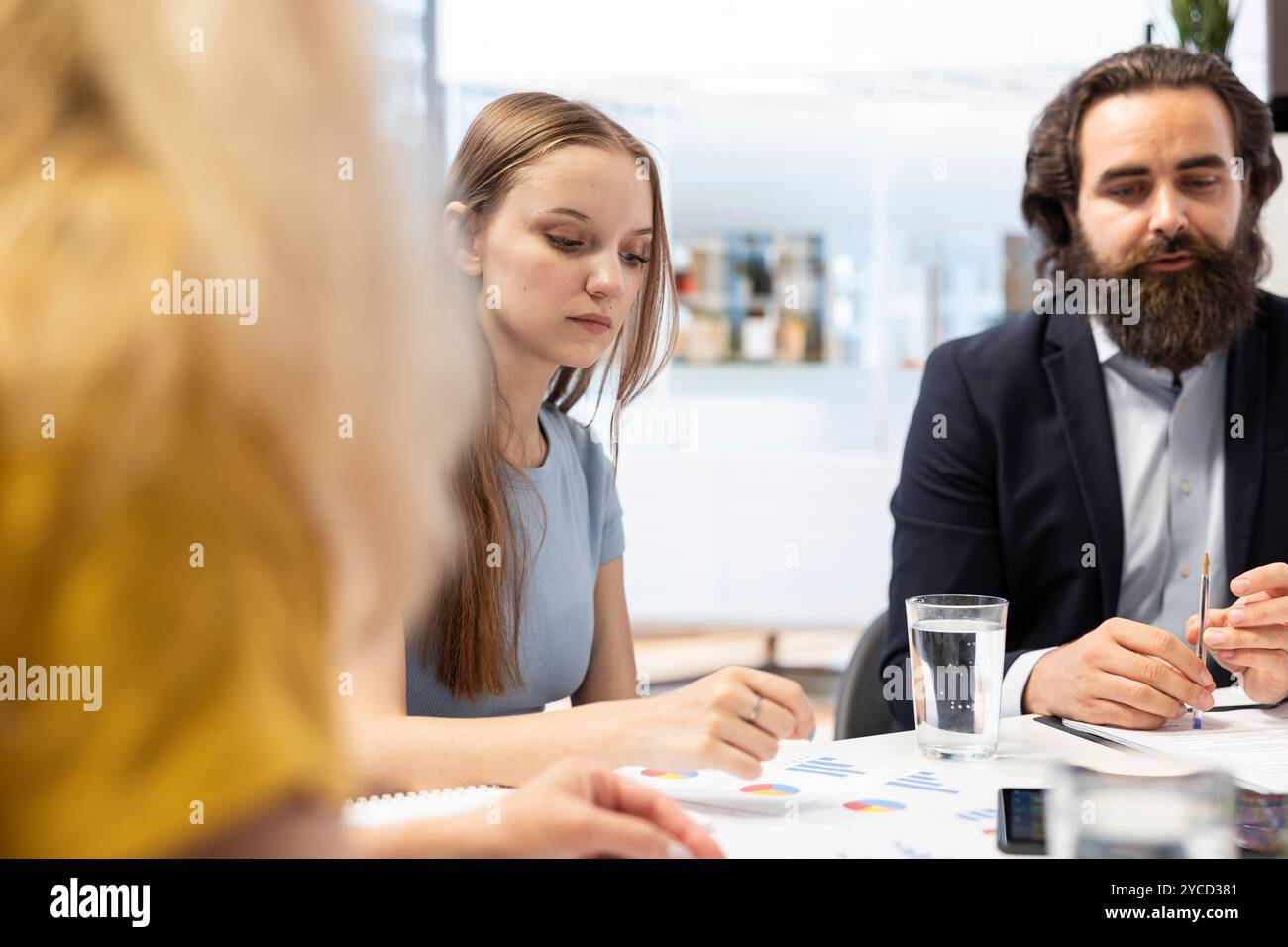 Financial advisor assessing clients economic goals to provide ...