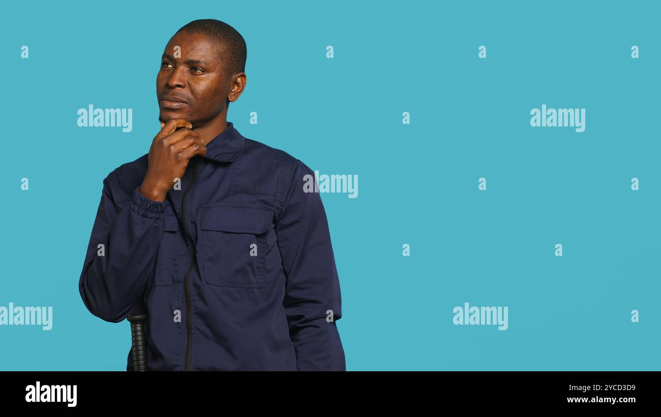 Security guard doing thinking hand gesture, being tasked with ...