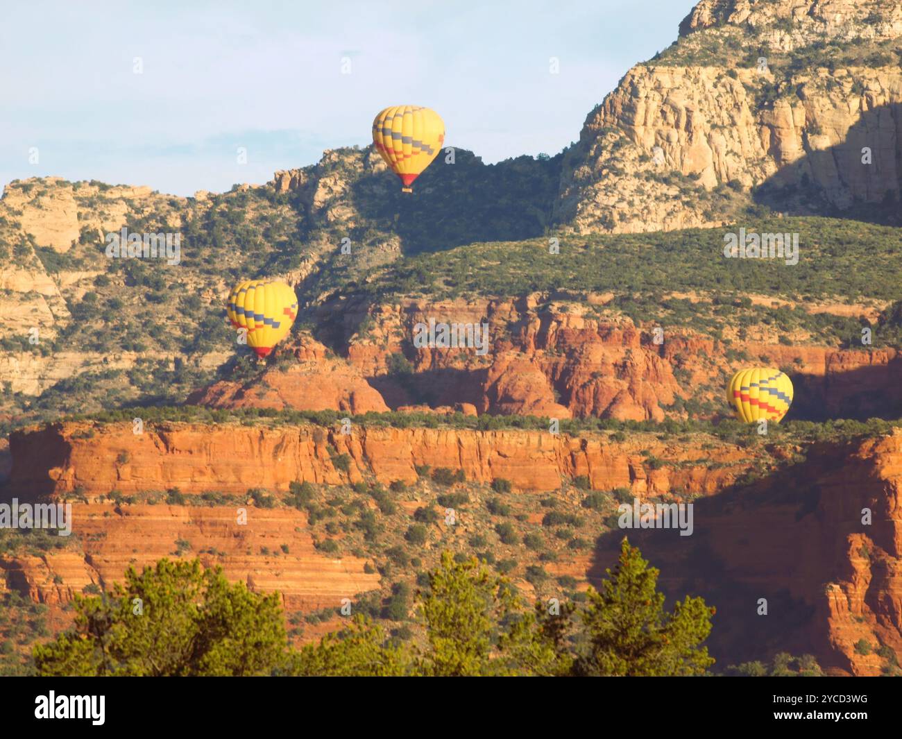 Three hot air balloons and Arizona red rocks Stock Photo - Alamy