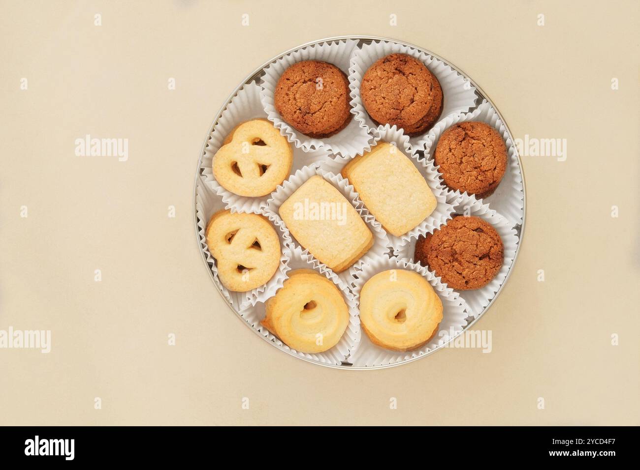 Cookies set in a metal box. Sweet dessert for holiday on beige ...