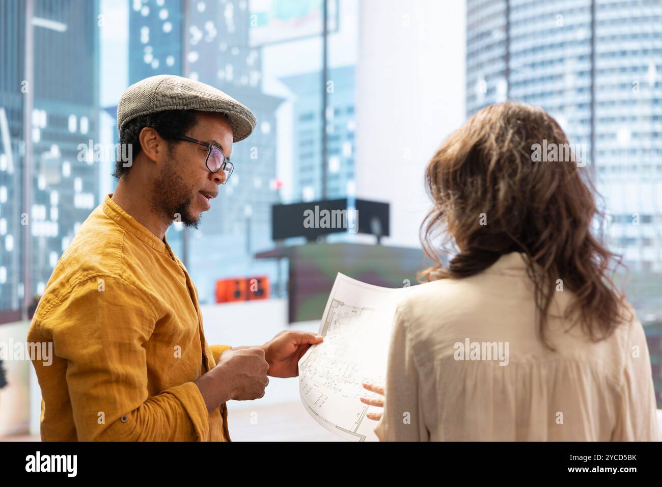 Real estate agent showing layout hi-res stock photography and images ...