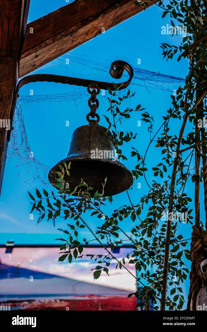 Bell hanging from wooden beam hi-res stock photography and images - Alamy