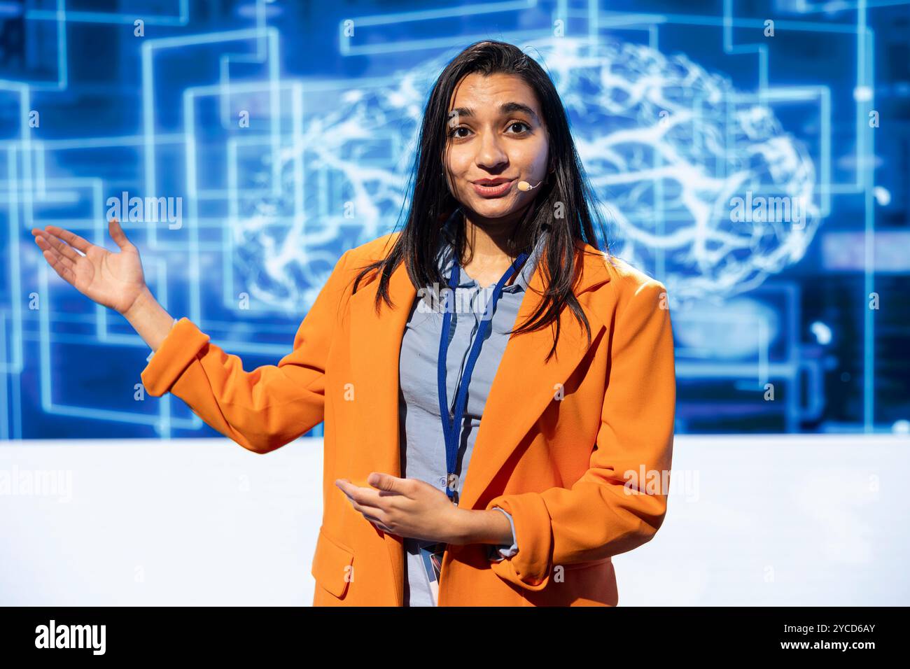 Portrait of engaging presenter talking at AI convention using mic ...