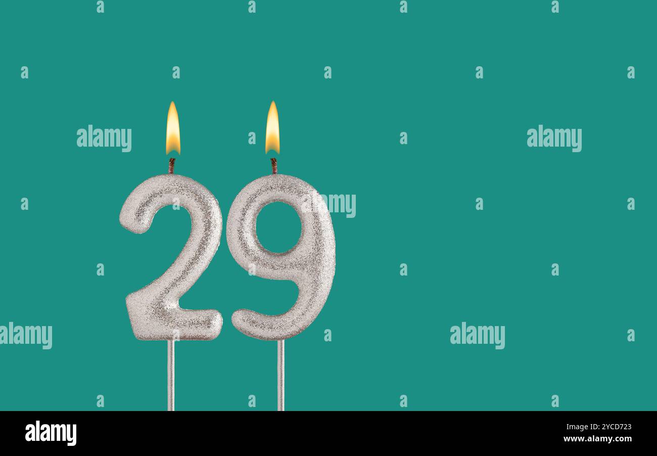 Birthday candle number 29 - Card on a green background Stock Photo - Alamy