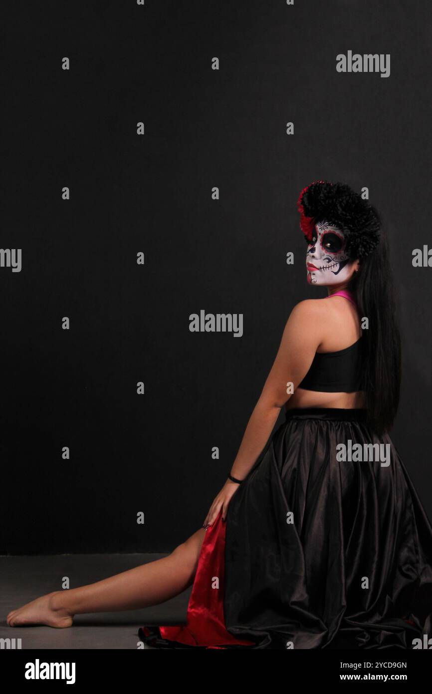 Dancer woman with skull makeup dances to celebrate the Day of the Dead ...