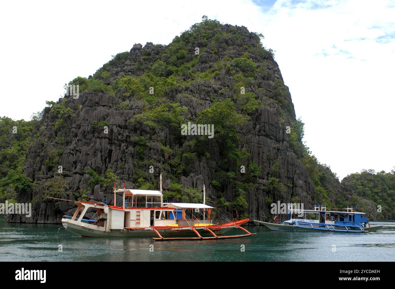 Tourist boats anchored in a small inlet, Coron, Palawan, Philippines ...