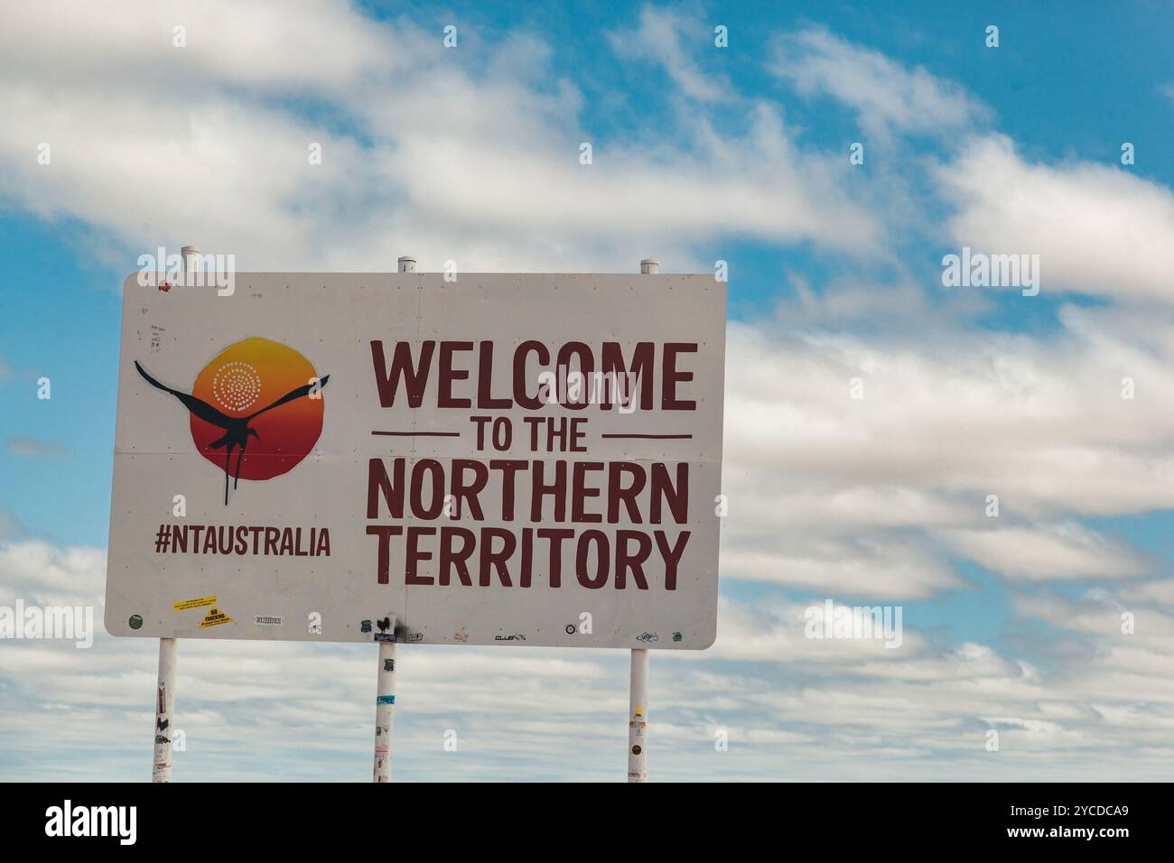 A vibrant welcome sign for the Northern Territory greets travelers in ...
