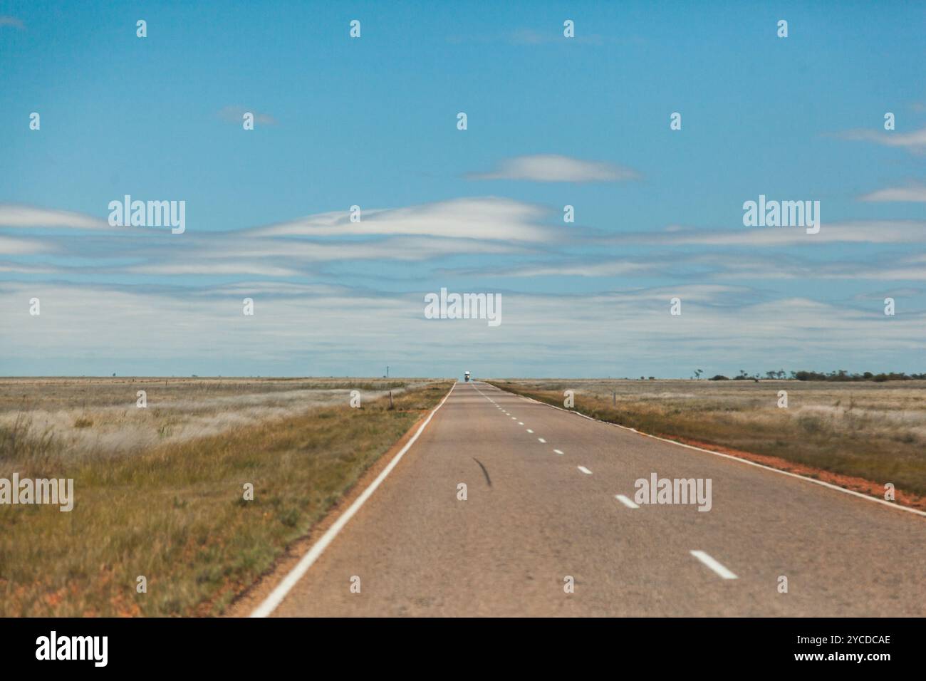 A long, open road stretches across the barren outback of Northern ...