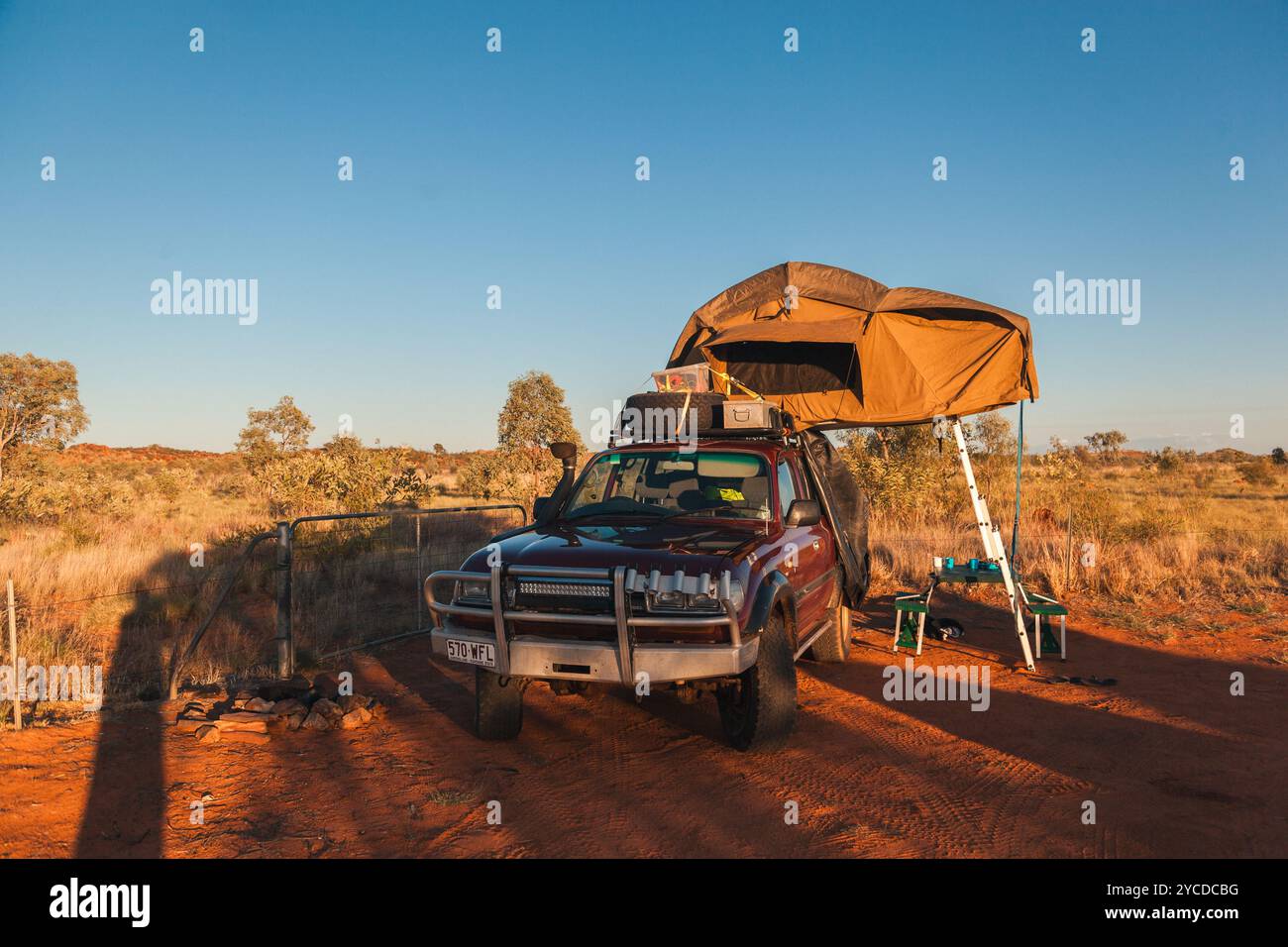Travelers camp under the clear blue sky of the Northern Territory ...