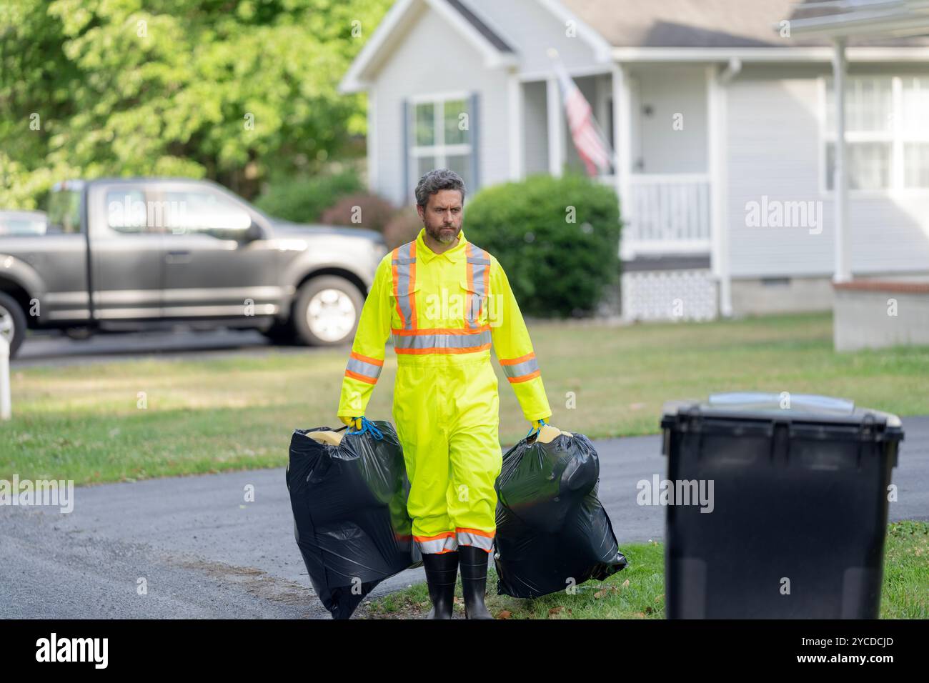Picking up garbage plastic for cleaning. Keeping garbage plastic into ...