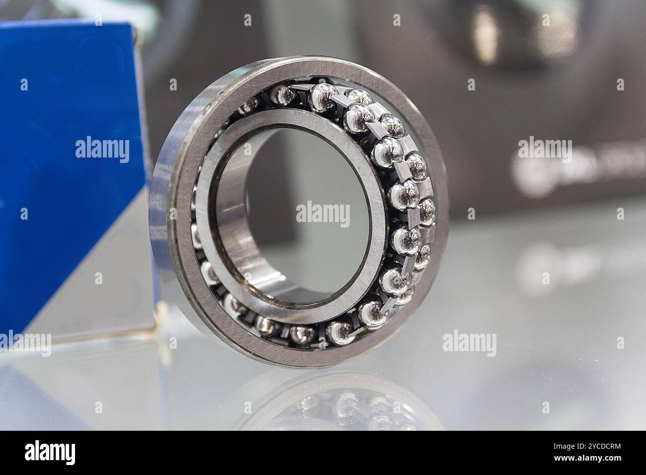 A modern ball bearing on display in close-up. Mechanical engineering ...