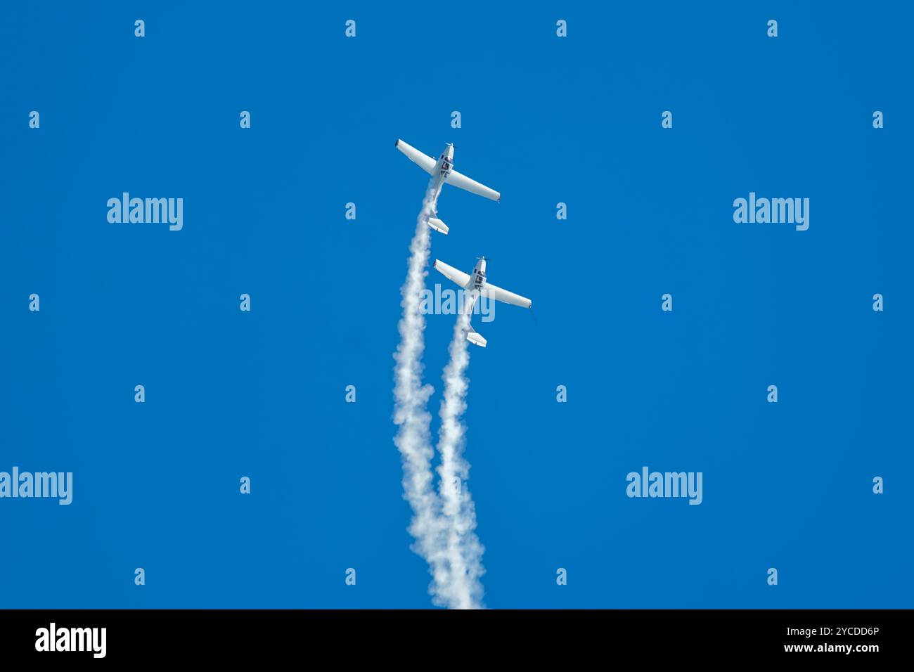 Stunt aerobatic plane performing stunts in air Stock Photo - Alamy