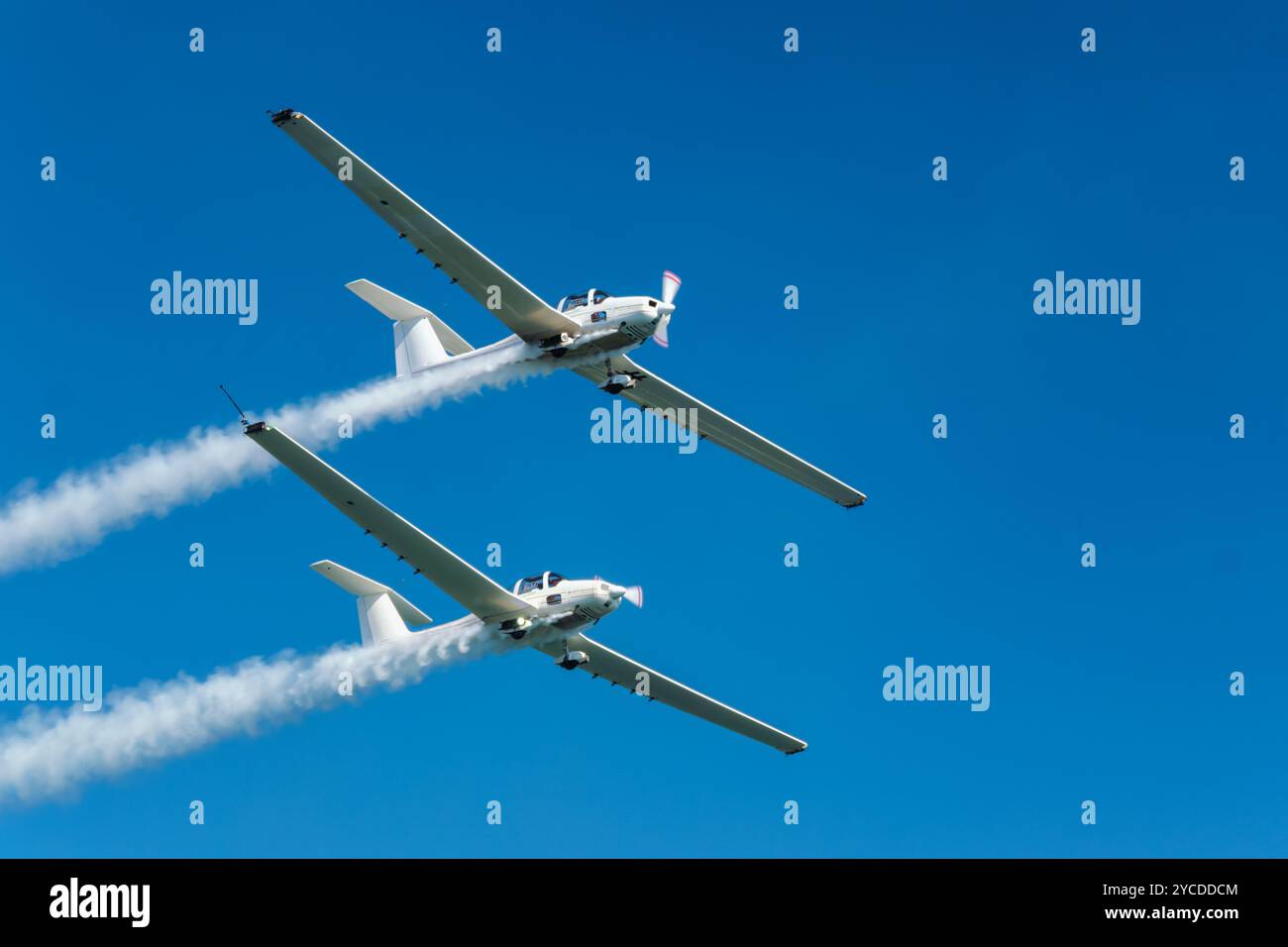 Stunt aerobatic plane performing stunts in air Stock Photo - Alamy