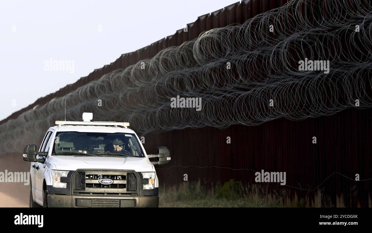A border patrol vehicle is seen along the border with Mexico in Bisbee ...