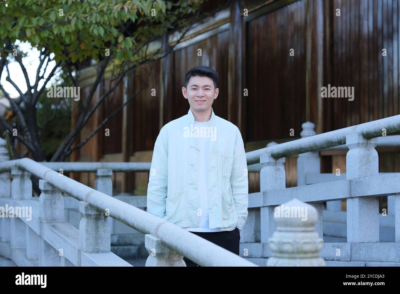Chinese young man smile and looking at camera, front view Stock Photo ...