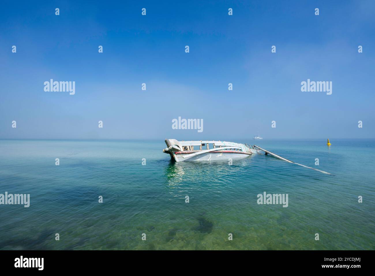 Wreck of sailing ship in clear water on a misty morning, Moon Point ...