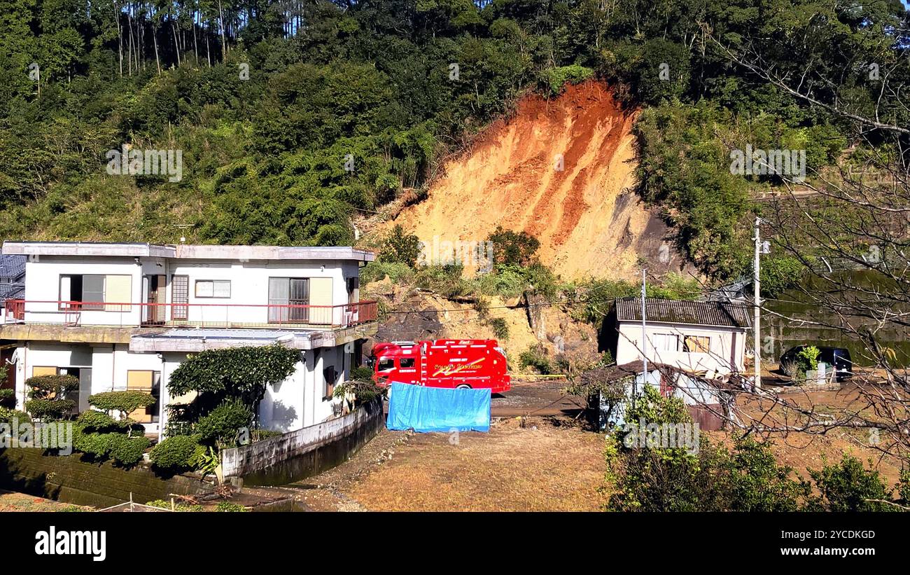 A house is buried by the mud of a collapsed slope in Nobeoka City ...