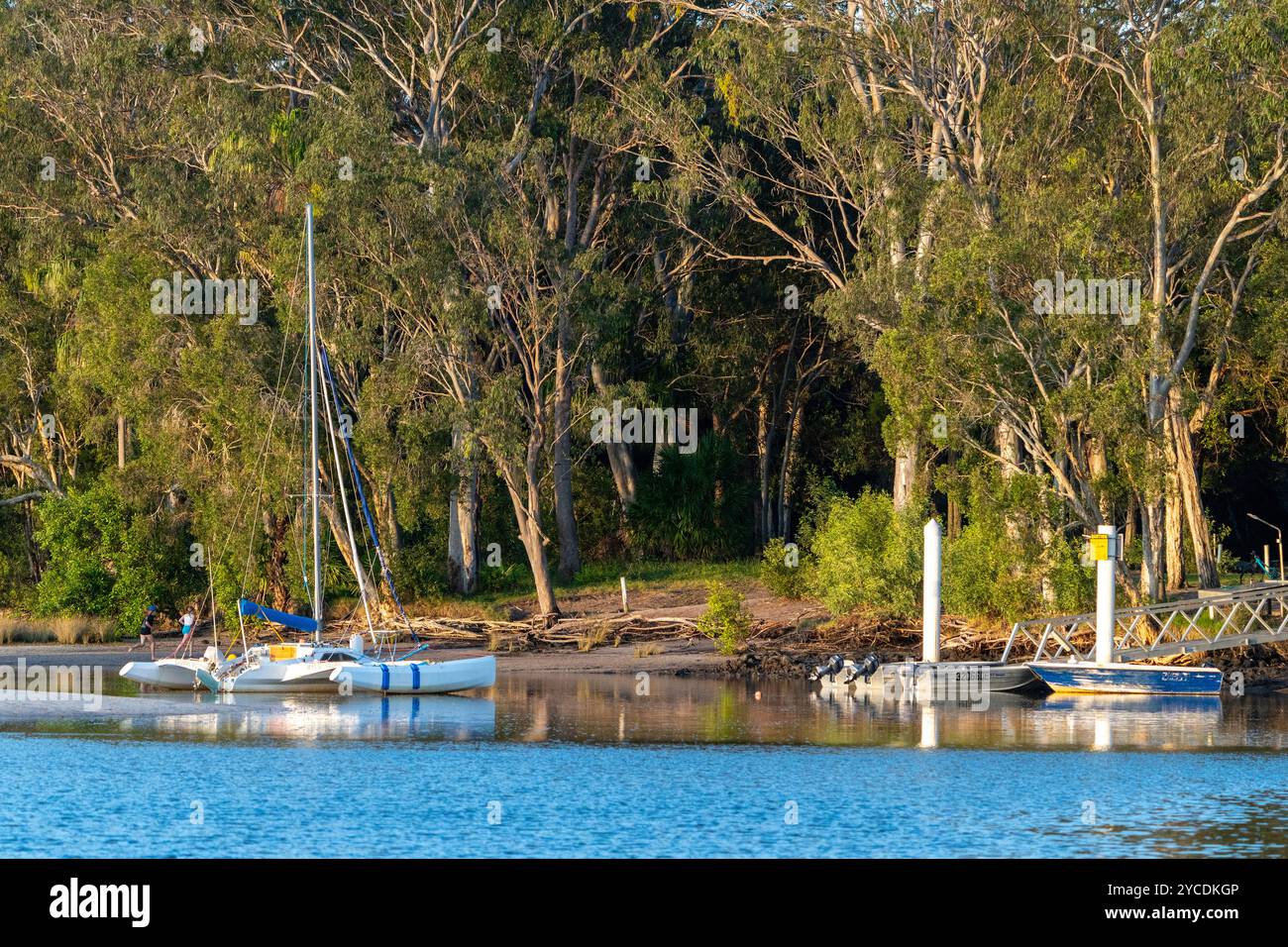 Sailing boat anchored at boat ramp at Carlo Point, Tin Can Bay Inlet ...