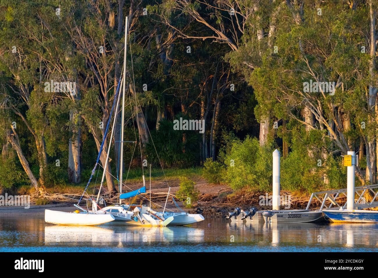 Sailing boat anchored at boat ramp at Carlo Point, Tin Can Bay Inlet ...