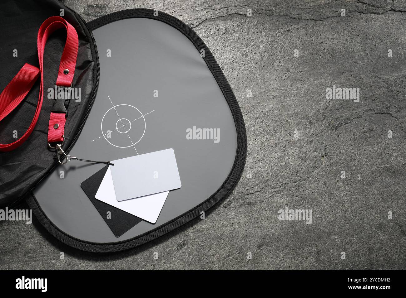 White balance calibration cards on grey background, top view. Space for ...