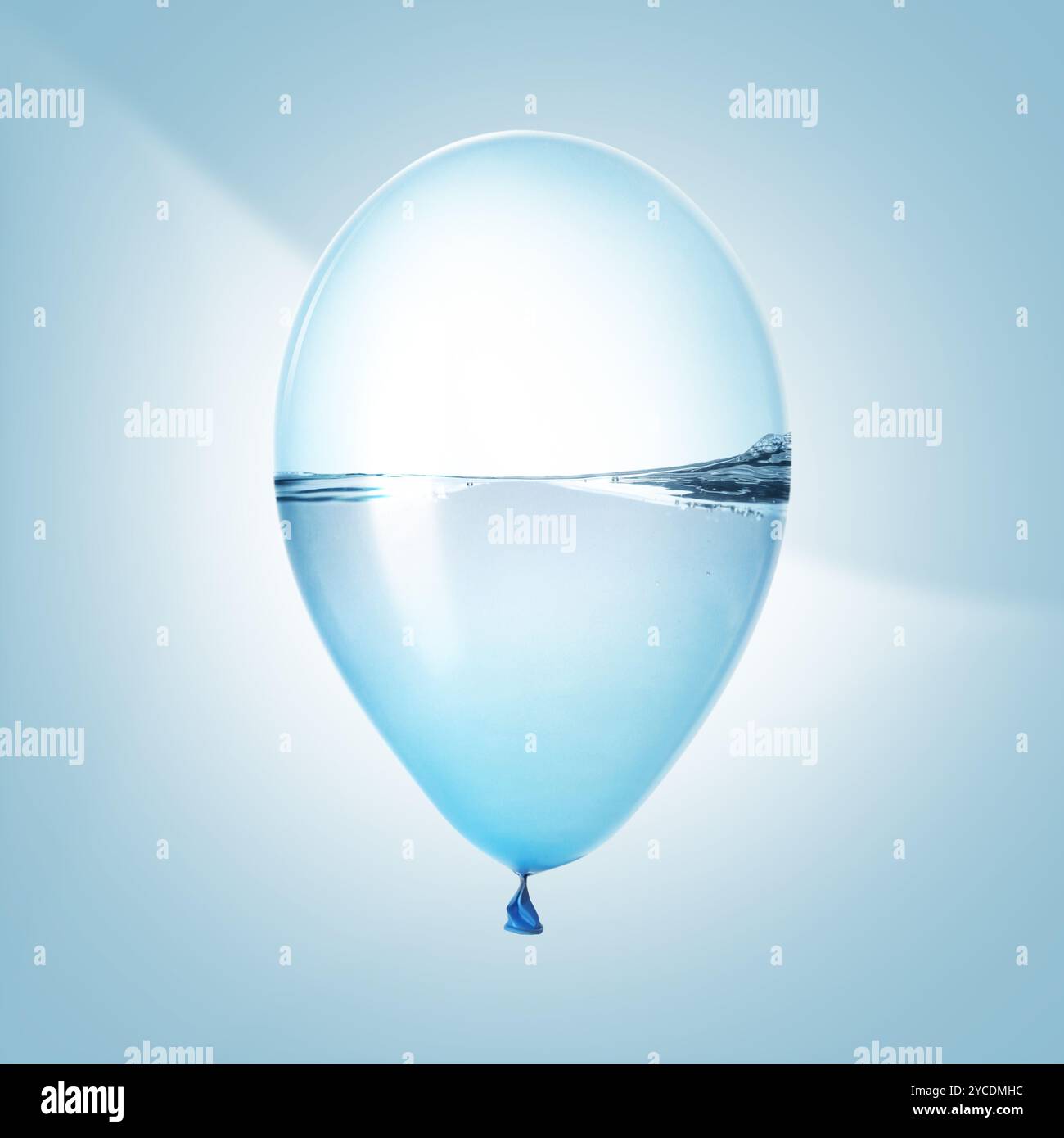 Balloon with water inside on light blue background Stock Photo - Alamy