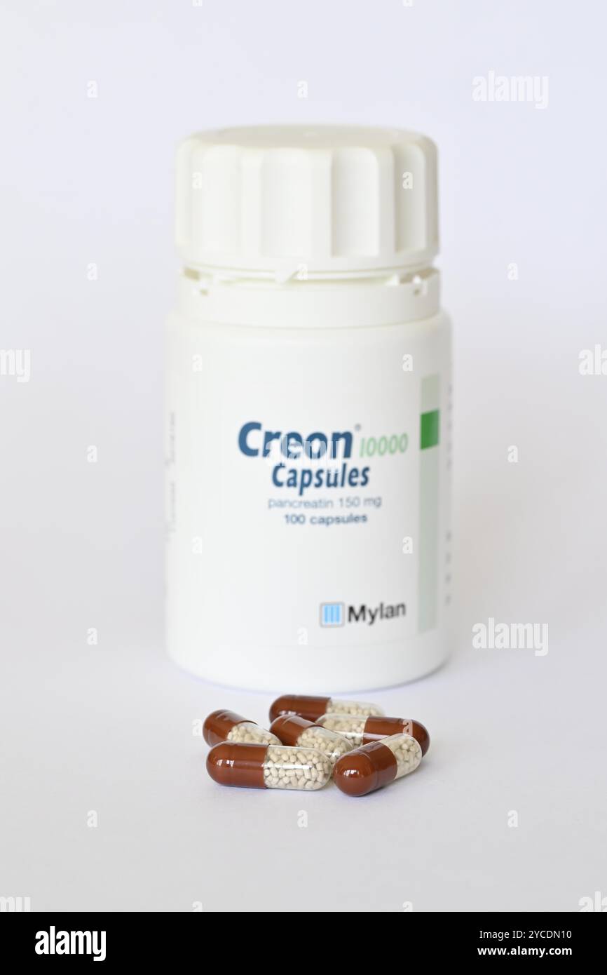 Bottle and capsules of a pancreatic enzyme medication marketed as Creon ...