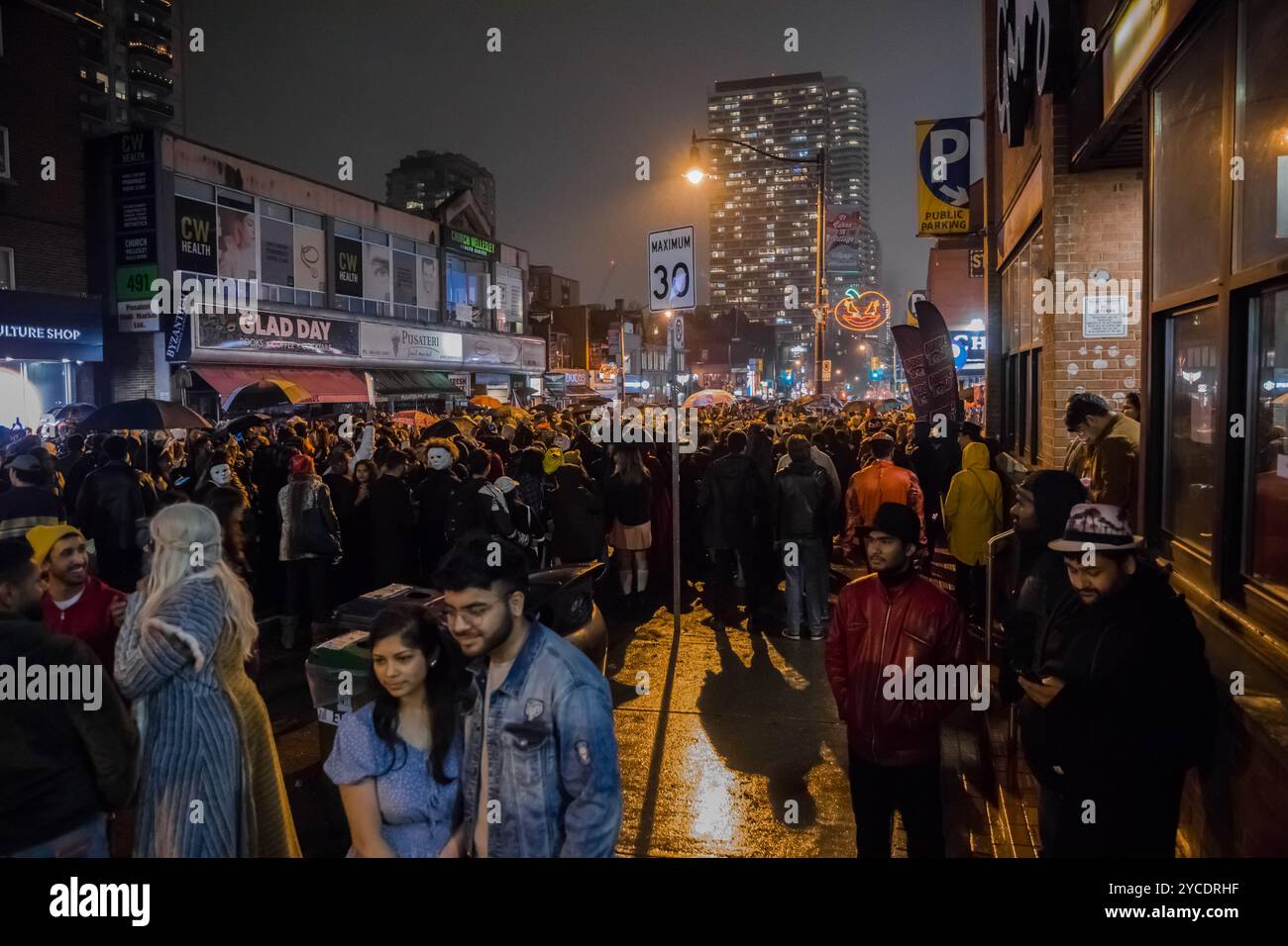 Halloween night parade on Church Street. A crowd in scary costumes ...
