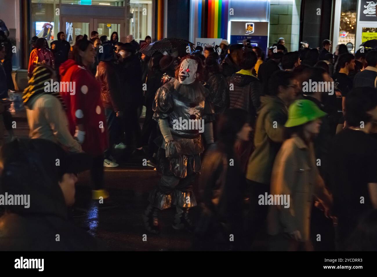 Halloween night parade on Church Street. A crowd in scary costumes ...