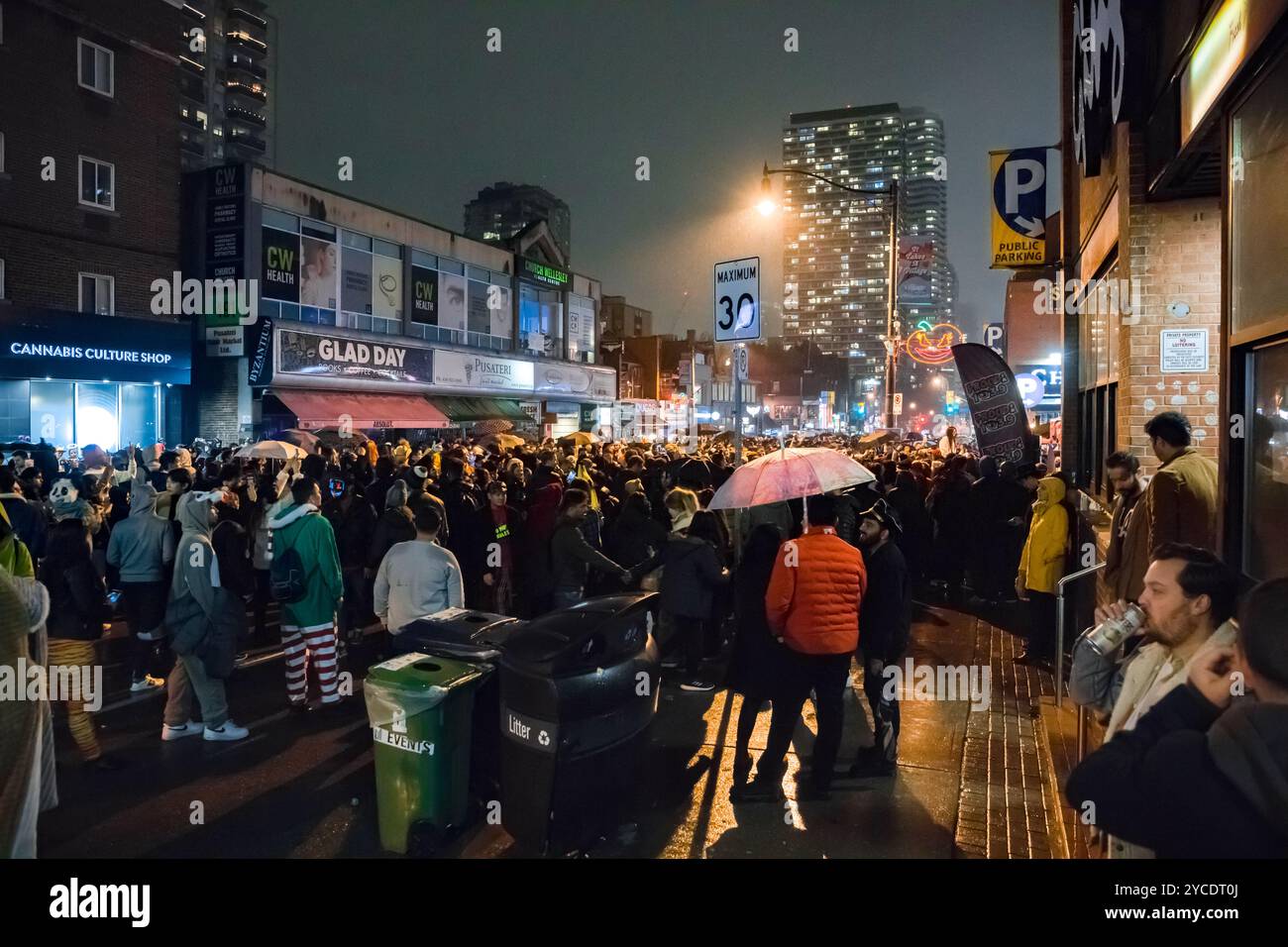 Halloween night parade on Church Street. A crowd in scary costumes ...