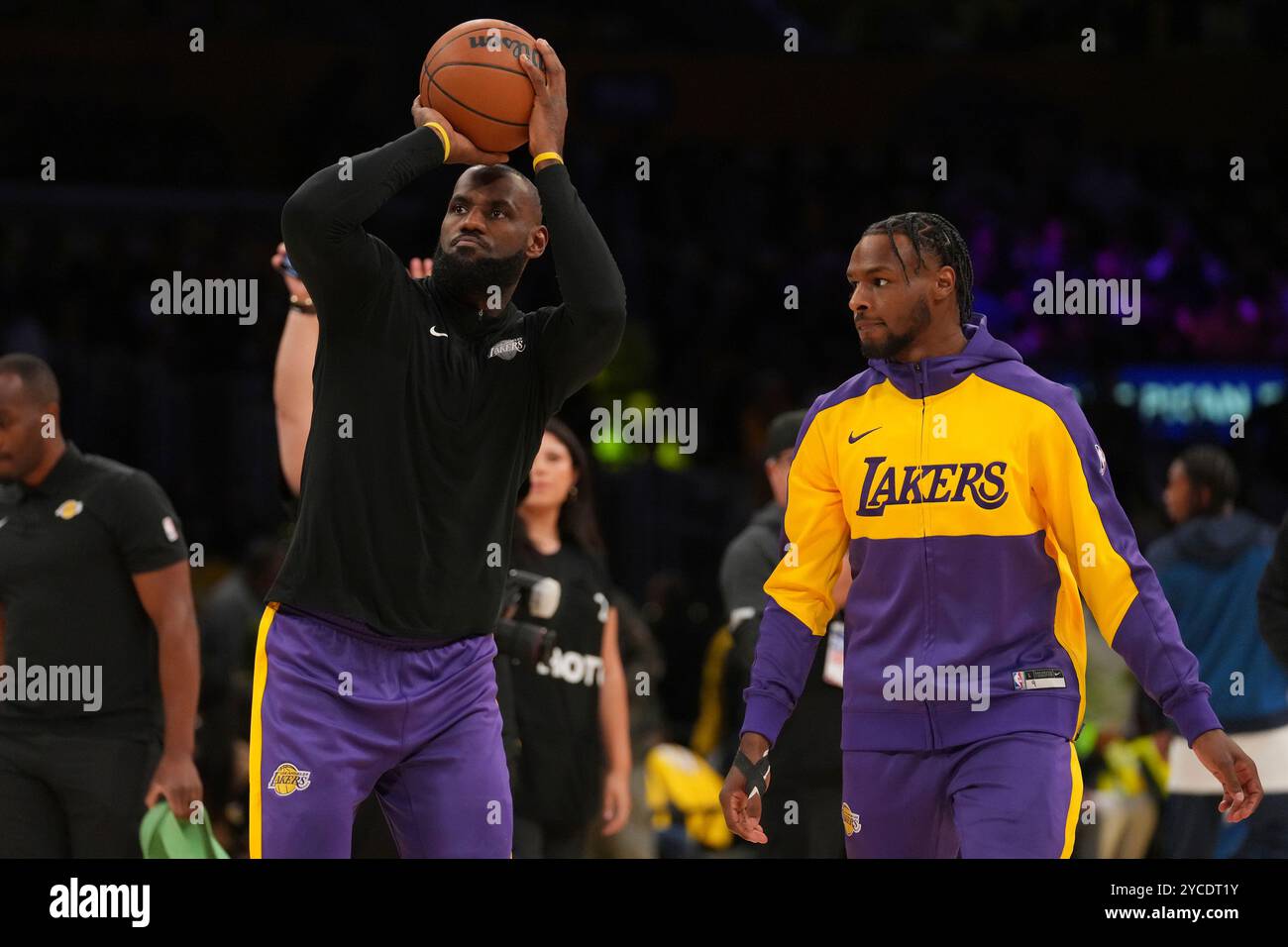 Los Angeles Lakers forward LeBron James, left, and guard Bronny James warm up before an NBA ...