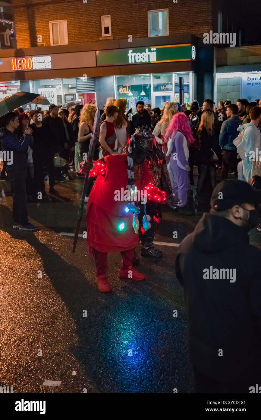 Halloween night parade on Church Street. A crowd in scary costumes ...