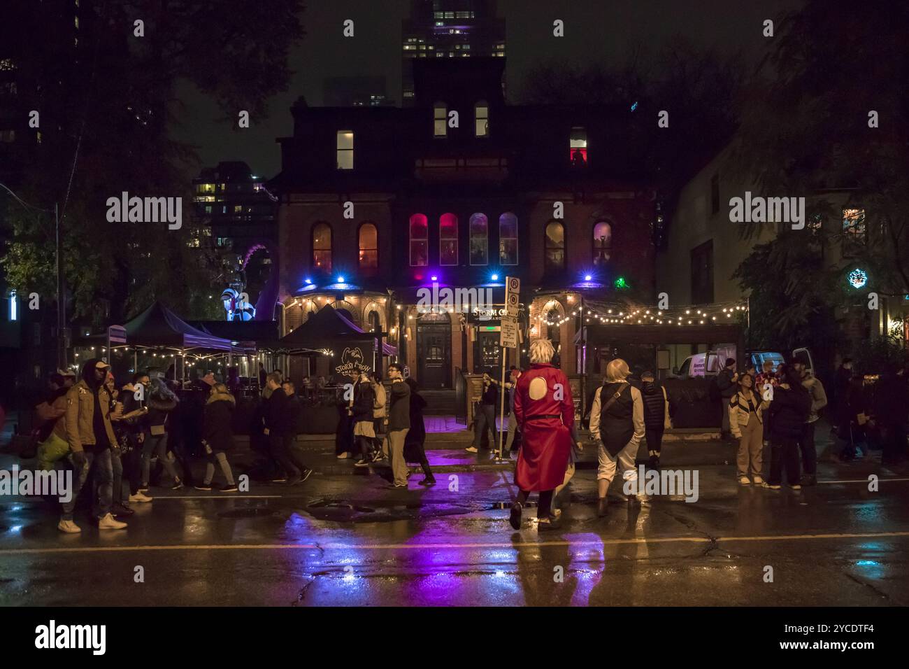 Halloween night parade on Church Street. A crowd in scary costumes ...