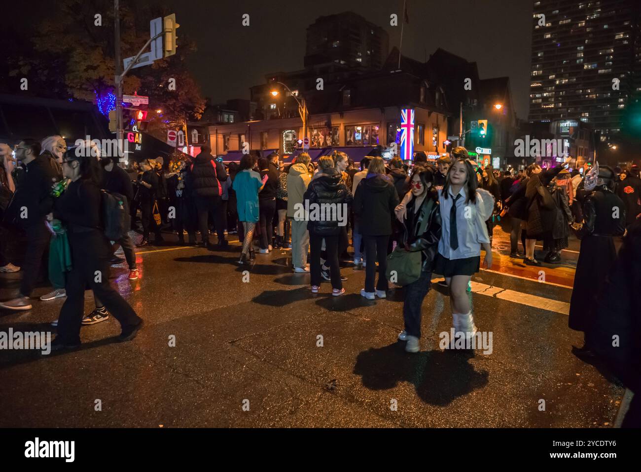 Halloween night parade on Church Street. A crowd in scary costumes ...