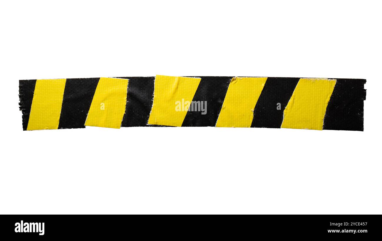DIY barricade tape made of yellow and black cloth tapes on white ...