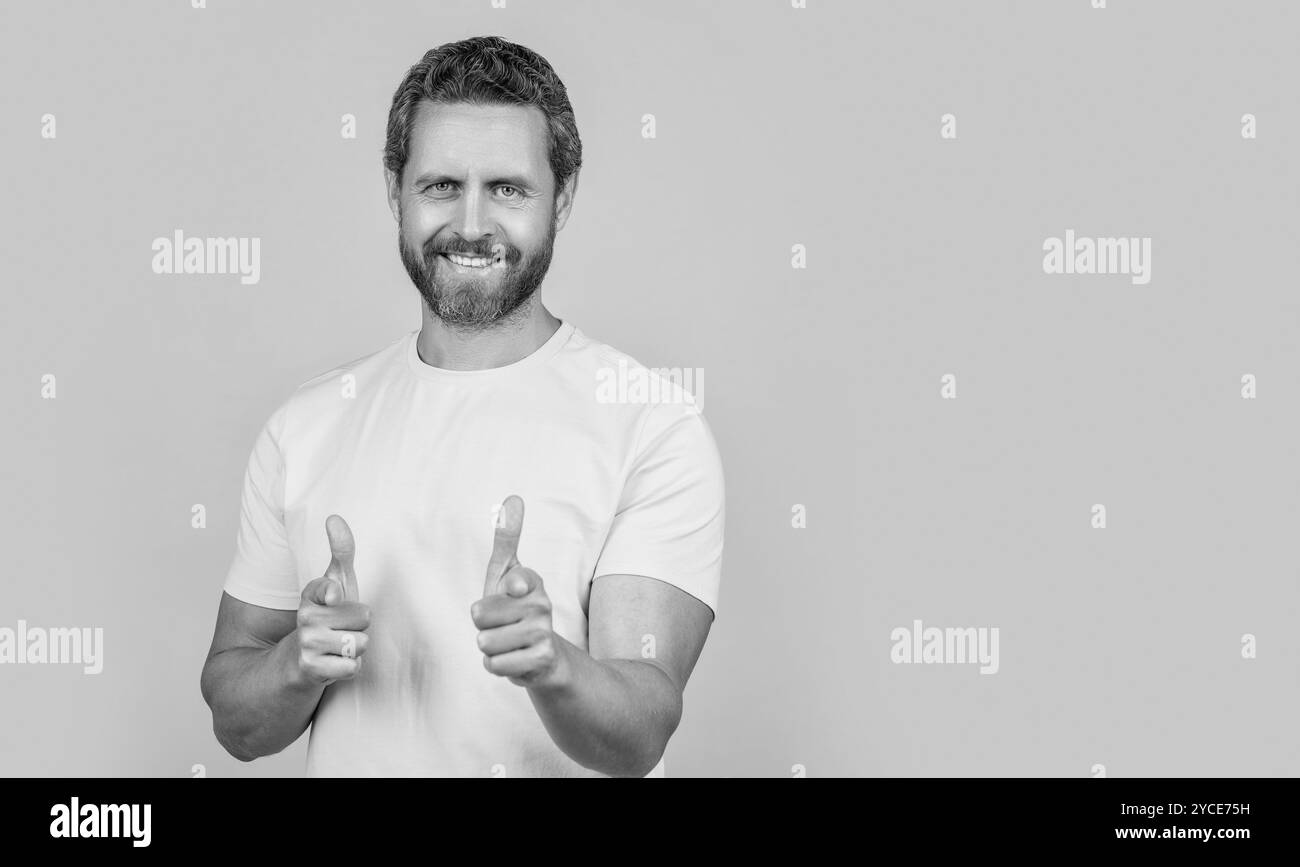 cheerful man offering advertisement in studio, copy space. photo of man ...