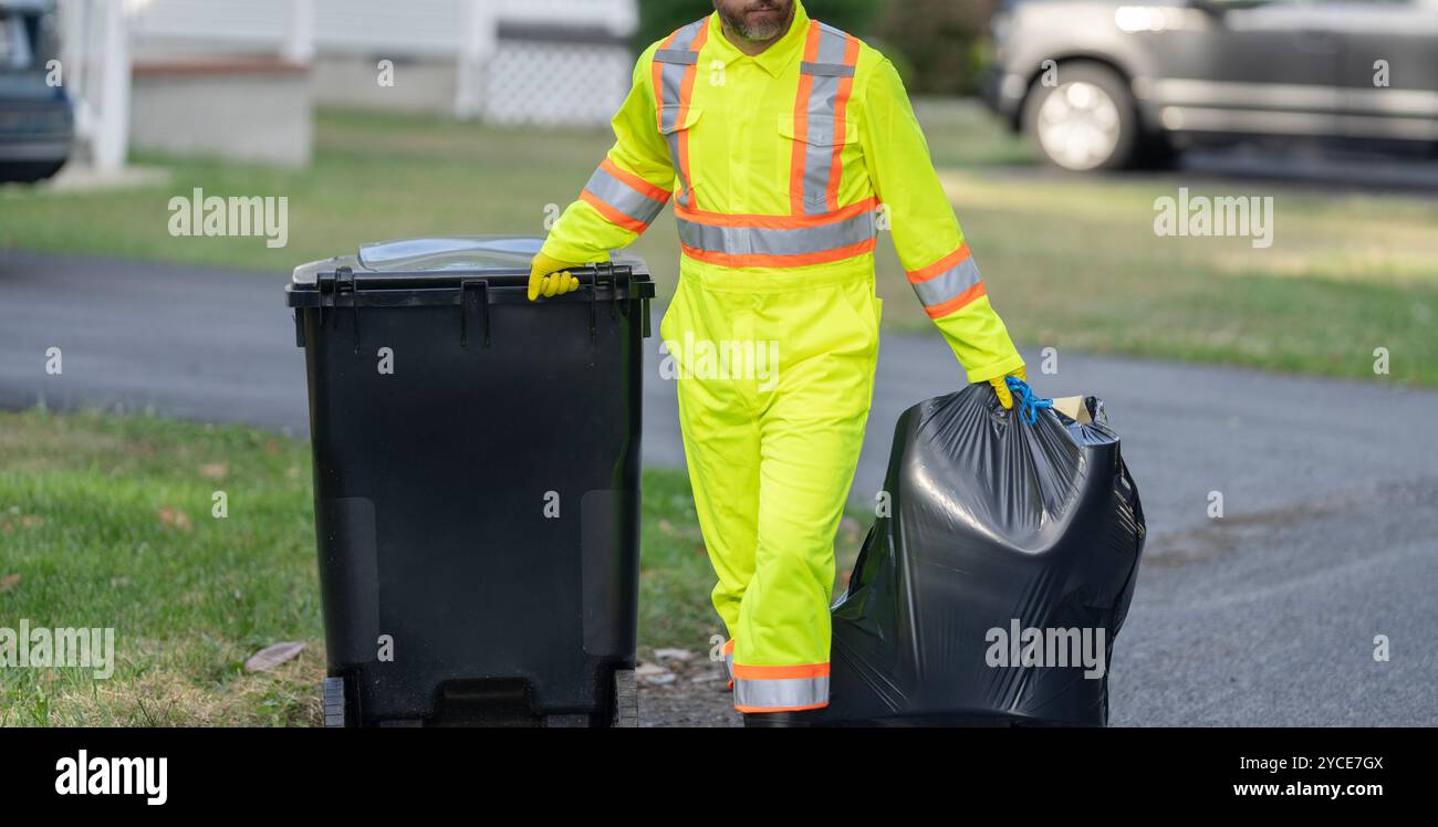 Man putting garbage bag in a trash bin. Environmental protection ...