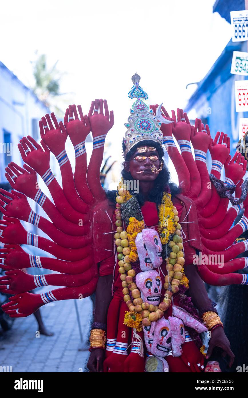 Kulasai Dasara, Portrait of indian hindu devotee with painted face and ...
