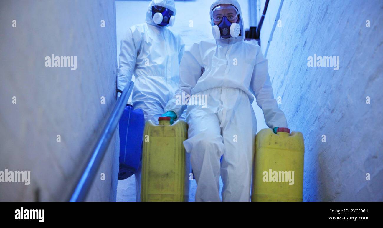 Chemical portrait, protection and people in hazmat suit on stairs in ...
