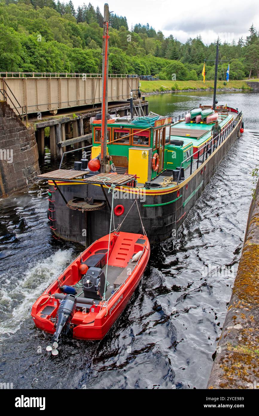 A barge passing through the locks at Gairlochy on the Caledonian Canal ...