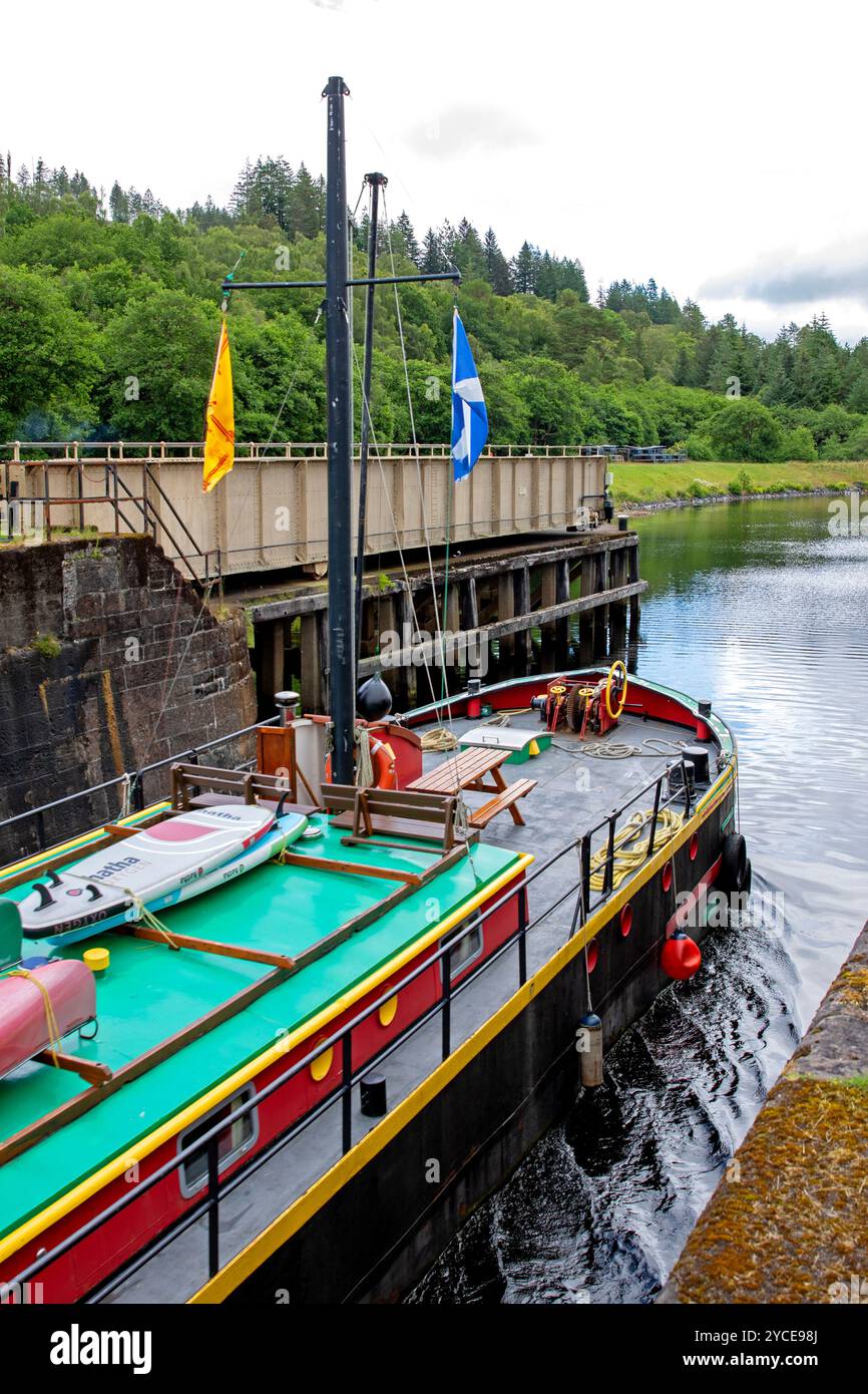 A barge passing through the locks at Gairlochy on the Caledonian Canal ...