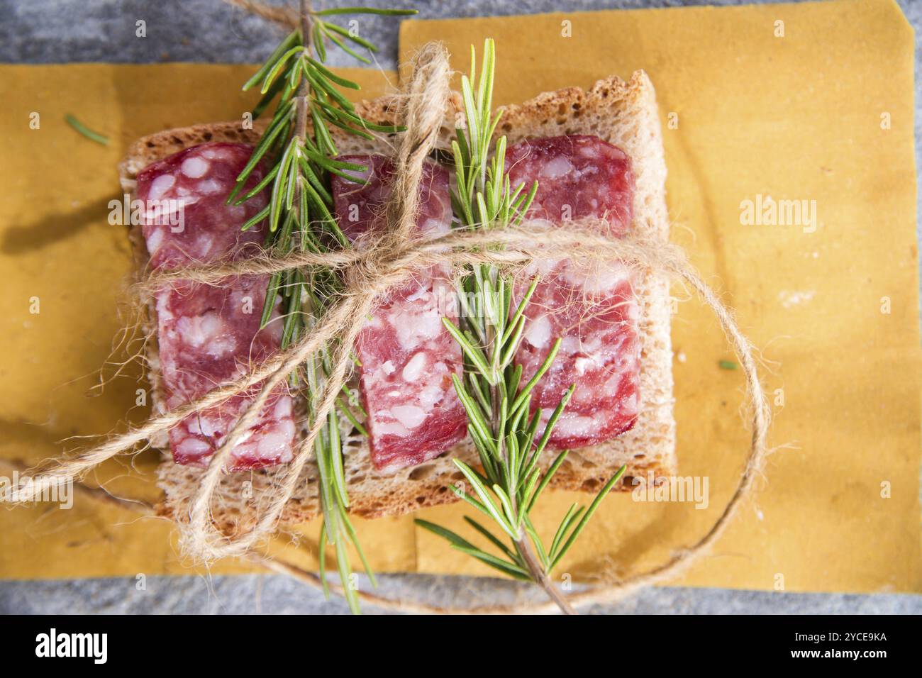Presentation of a snack of bread and salami Stock Photo - Alamy
