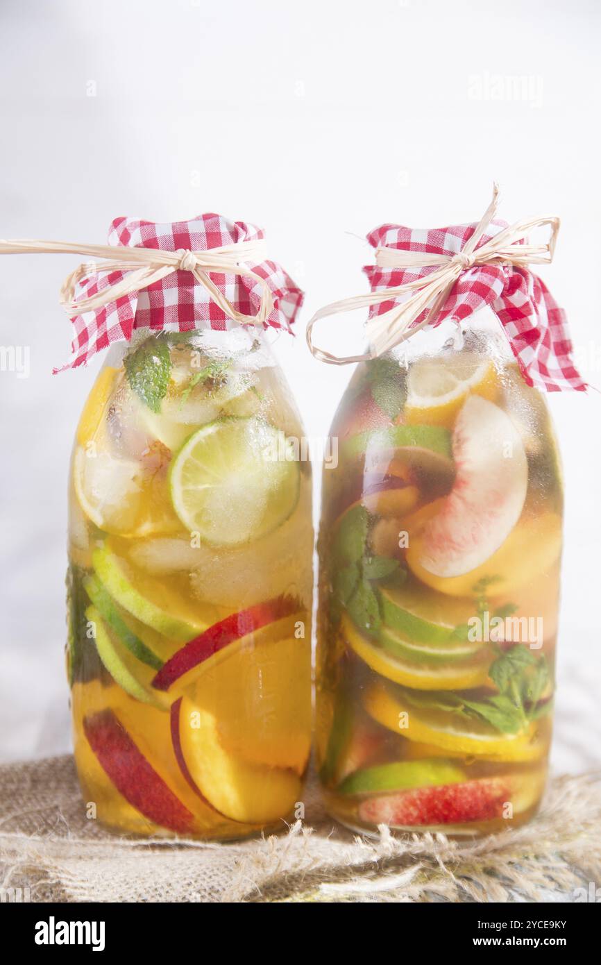 Bottle of infused fruit tea with peach and lemon Stock Photo - Alamy