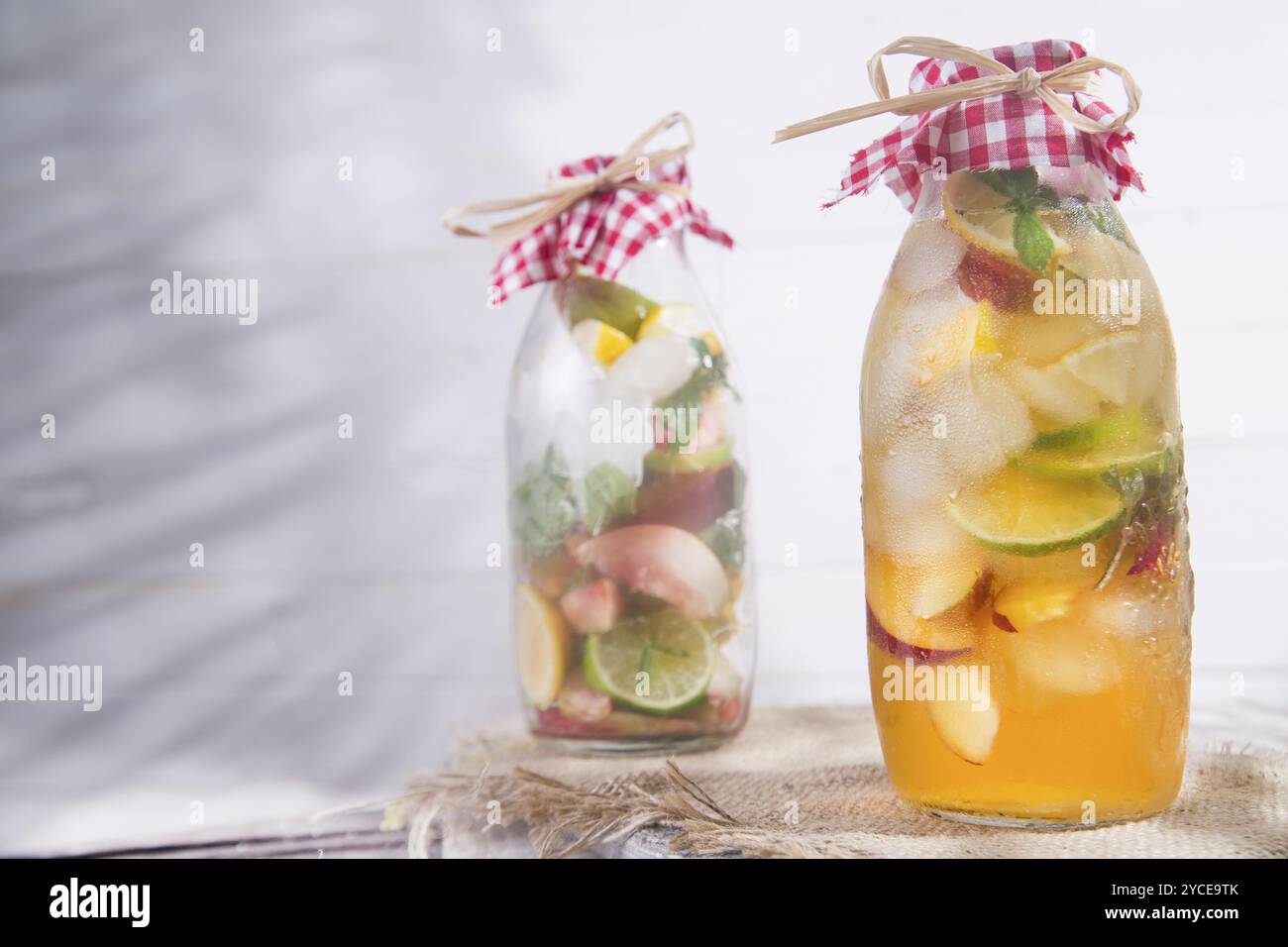 Bottle of infused fruit tea with peach and lemon Stock Photo - Alamy