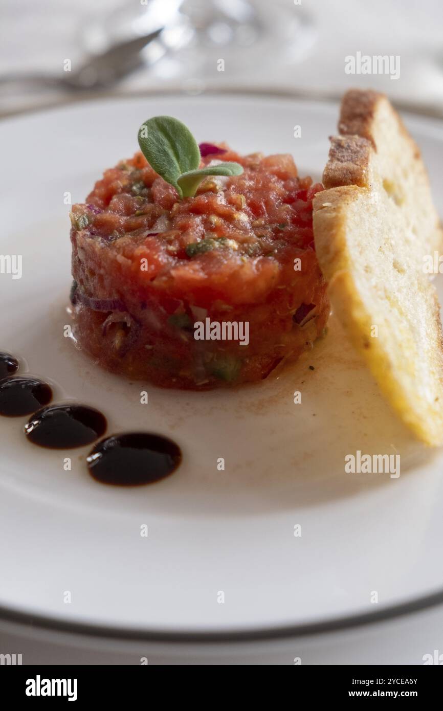 Tomato tartare, capers, onion, bread chip, Christmas 2023 feast ...