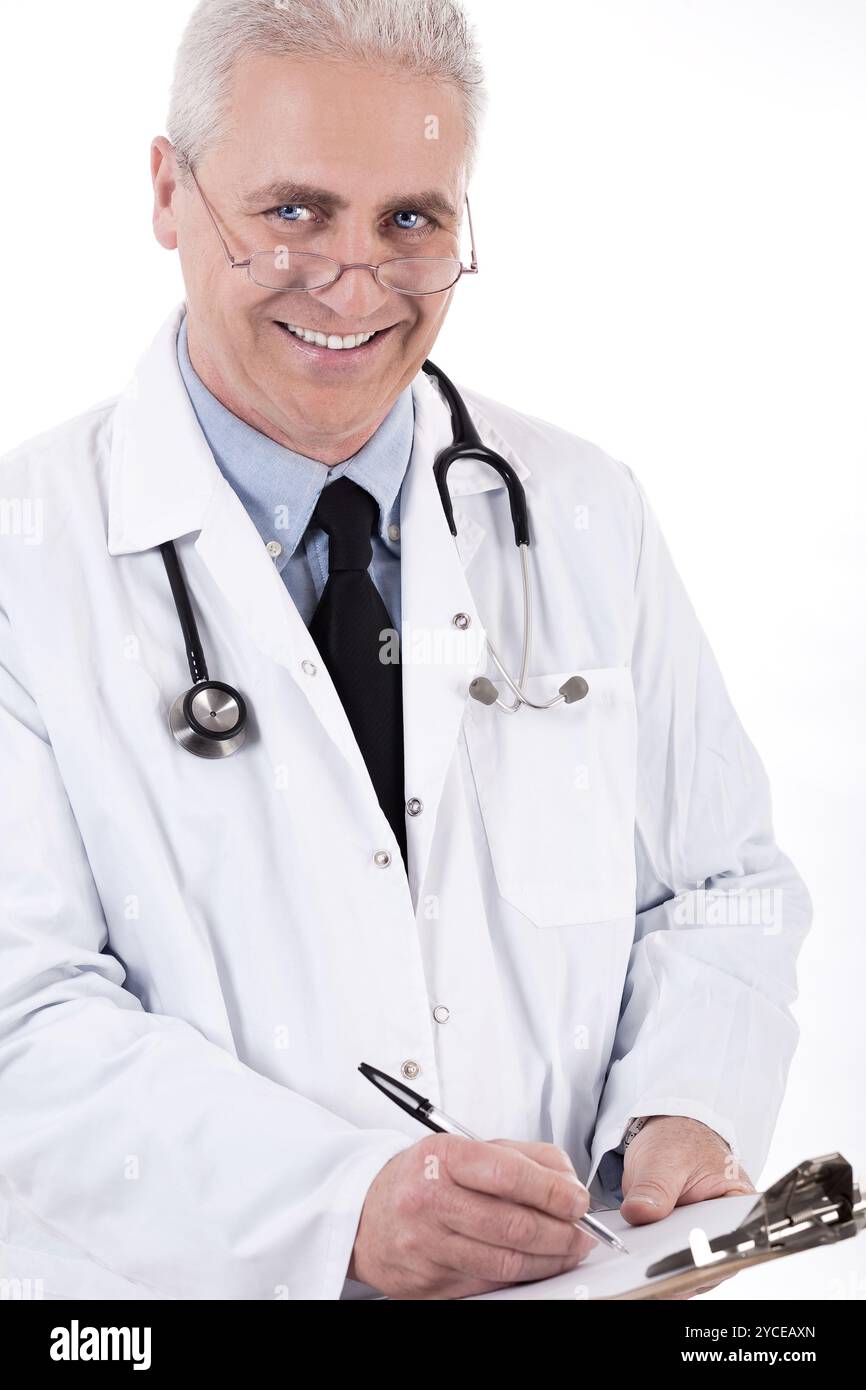 Smiling medical doctor writing prescription on white background Stock ...