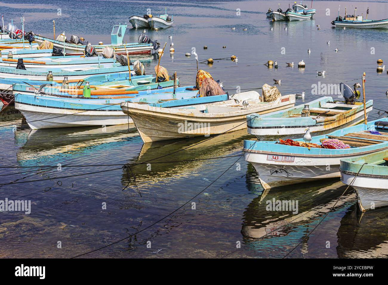 Fishing boats anchored in the harbour of Mirbat, Dhofar Province ...