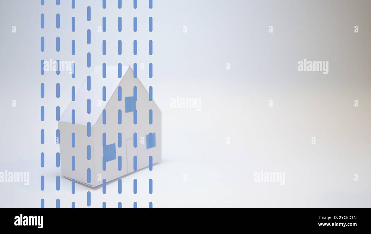 An insurer's hand protects a paper house from natural disasters ...